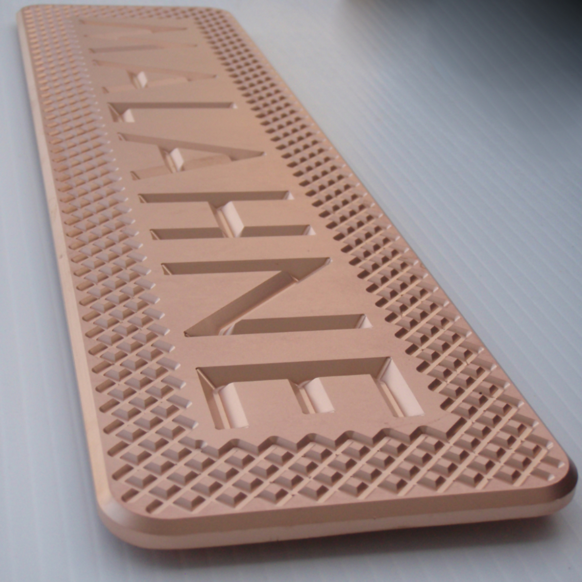 Deep bronze engraving – Safire Associates