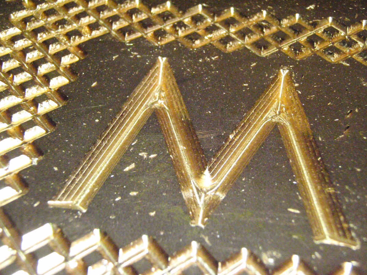 Deep bronze engraving – Safire Associates